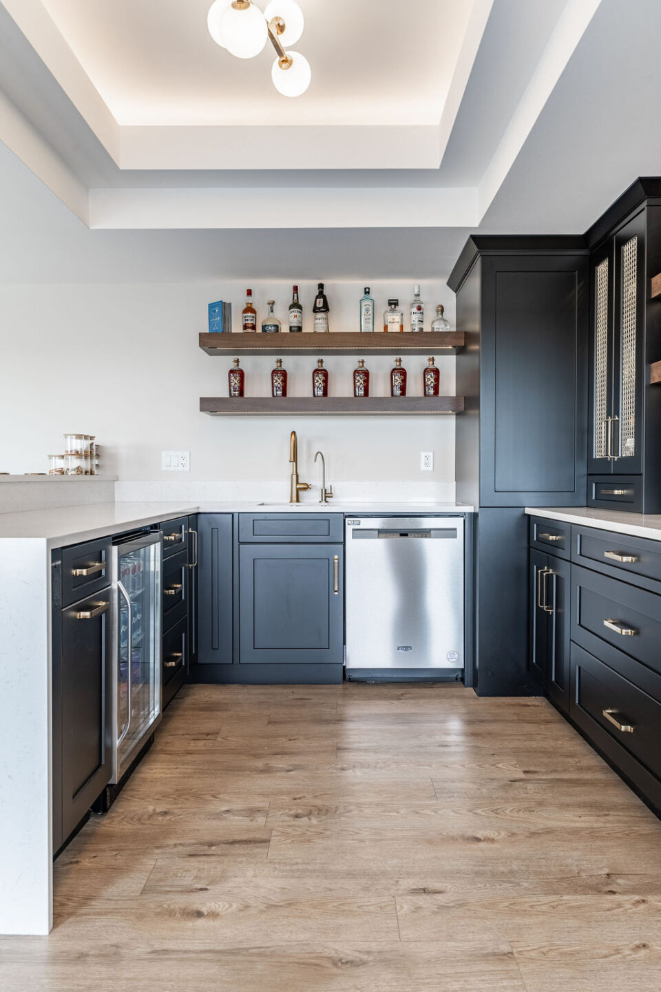 Walkout basement with full bar island - Axium Interiors